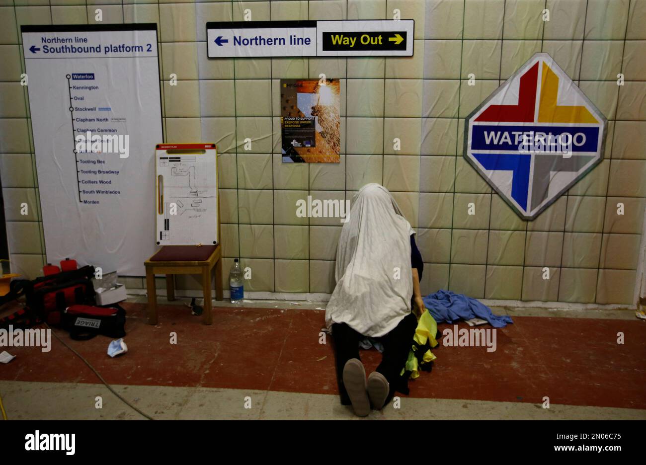 A dummy used to illustrate a fatal casualty is placed against a wall in ...