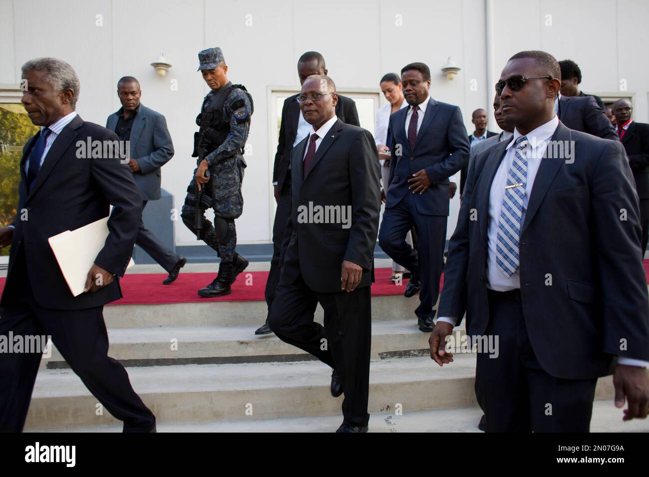 Haiti's interim President Jocelerme Privert, center, arrives with new ...