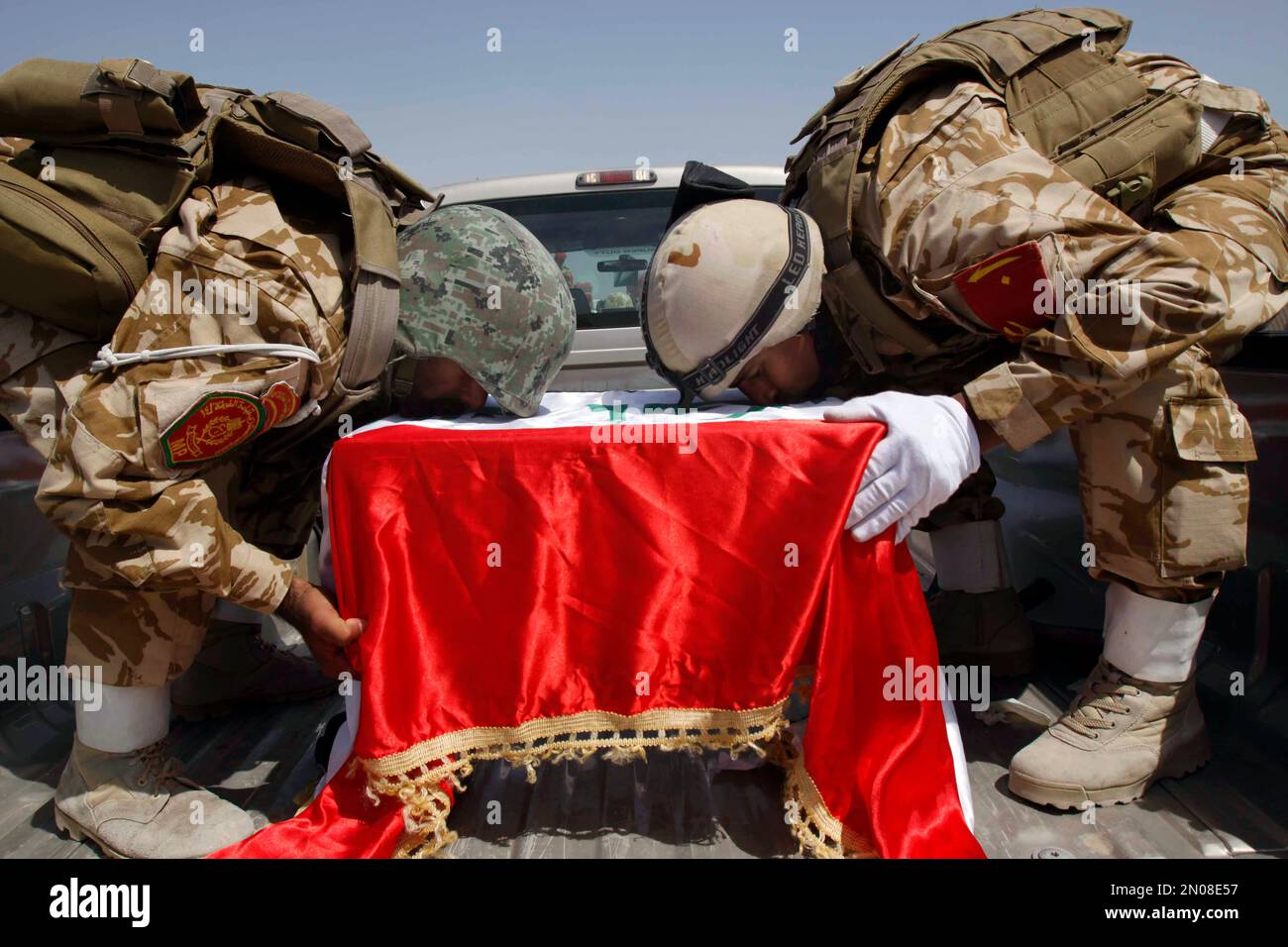 FILE - In this Tuesday, March 30, 2010 file photo, Iraqi soldiers kiss ...