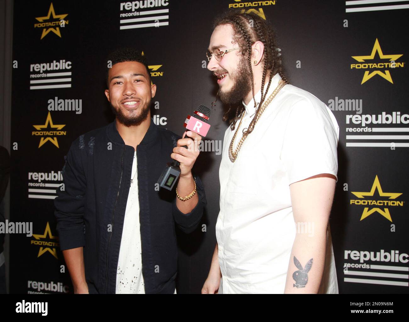 Lawrence Jackson, left, interviews Post Malone at the Republic Records ...