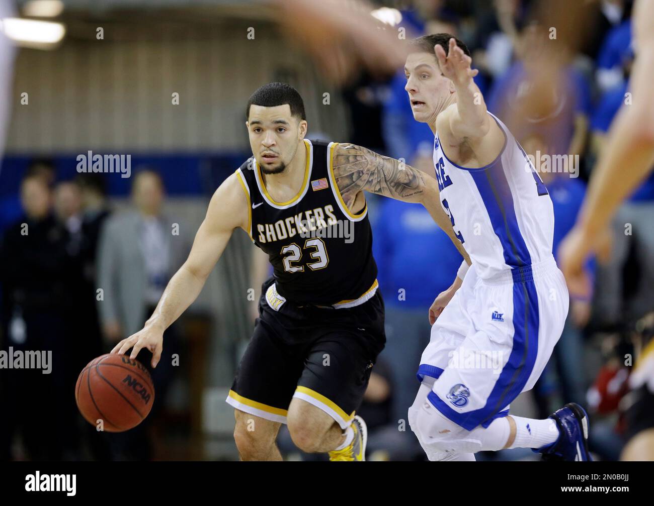 Wichita State guard Fred VanVleet (23) drives up court past Drake guard ...