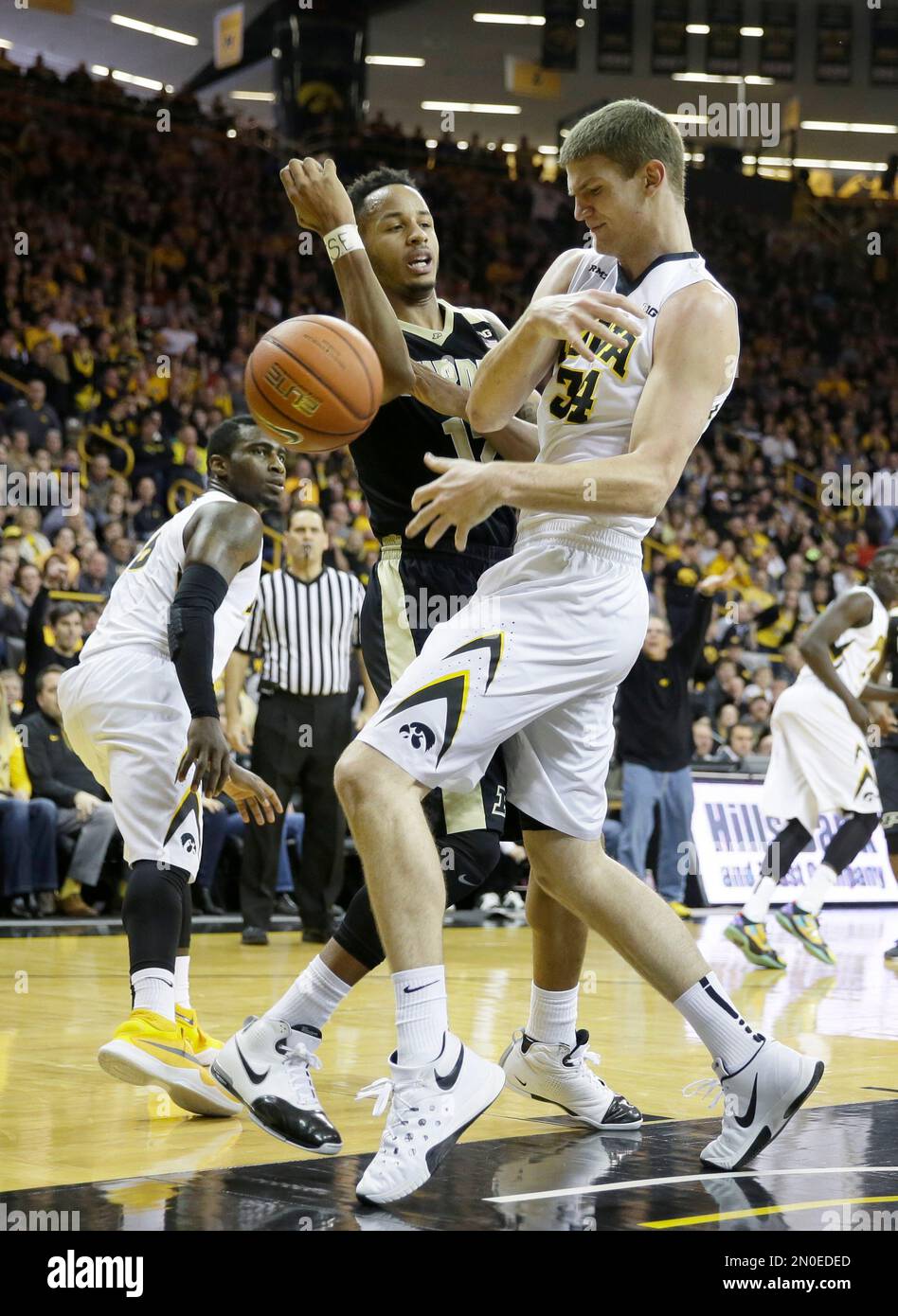 Iowa center Adam Woodbury fights for a rebound with Purdue forward ...