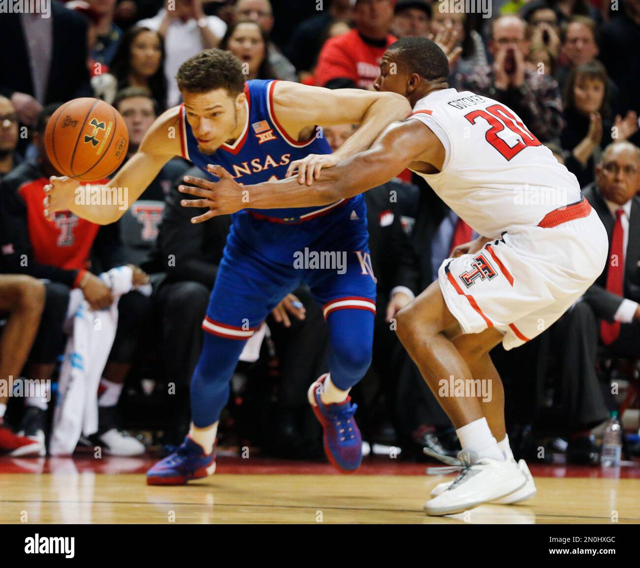Kansas guard Brannen Greene, left, gets the ball knocked out of his ...