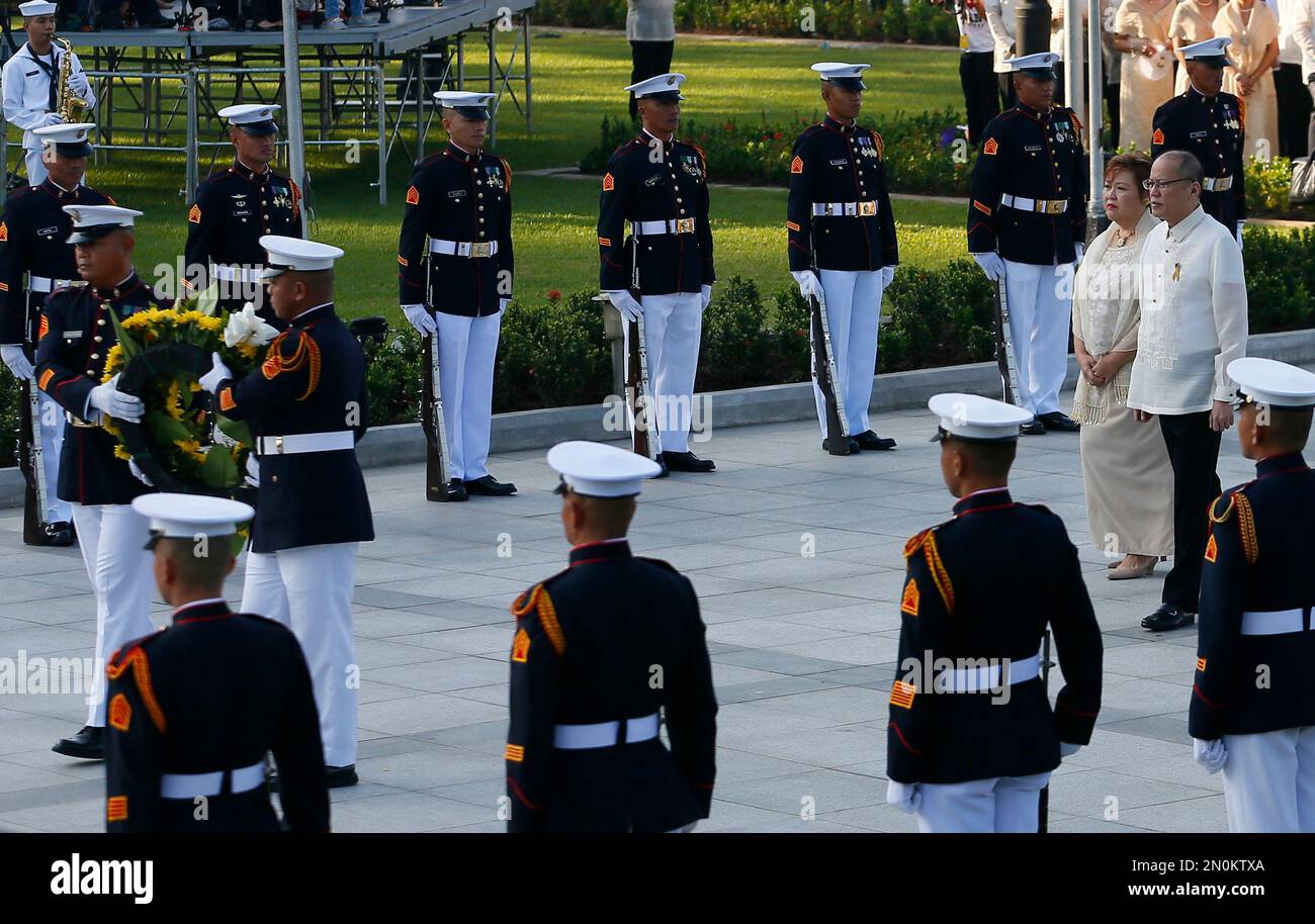 Philippine President Benigno Aquino III, accompanied by Maria Serena ...