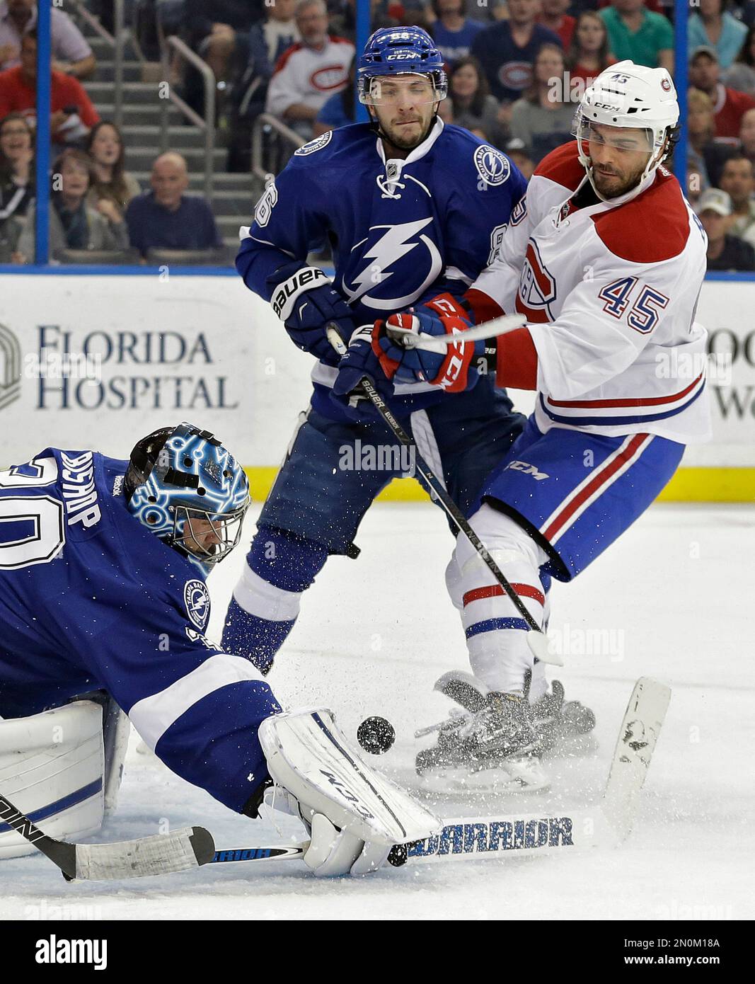 Tampa Bay Lightning goalie Ben Bishop (30) dives on a shot by Montreal ...