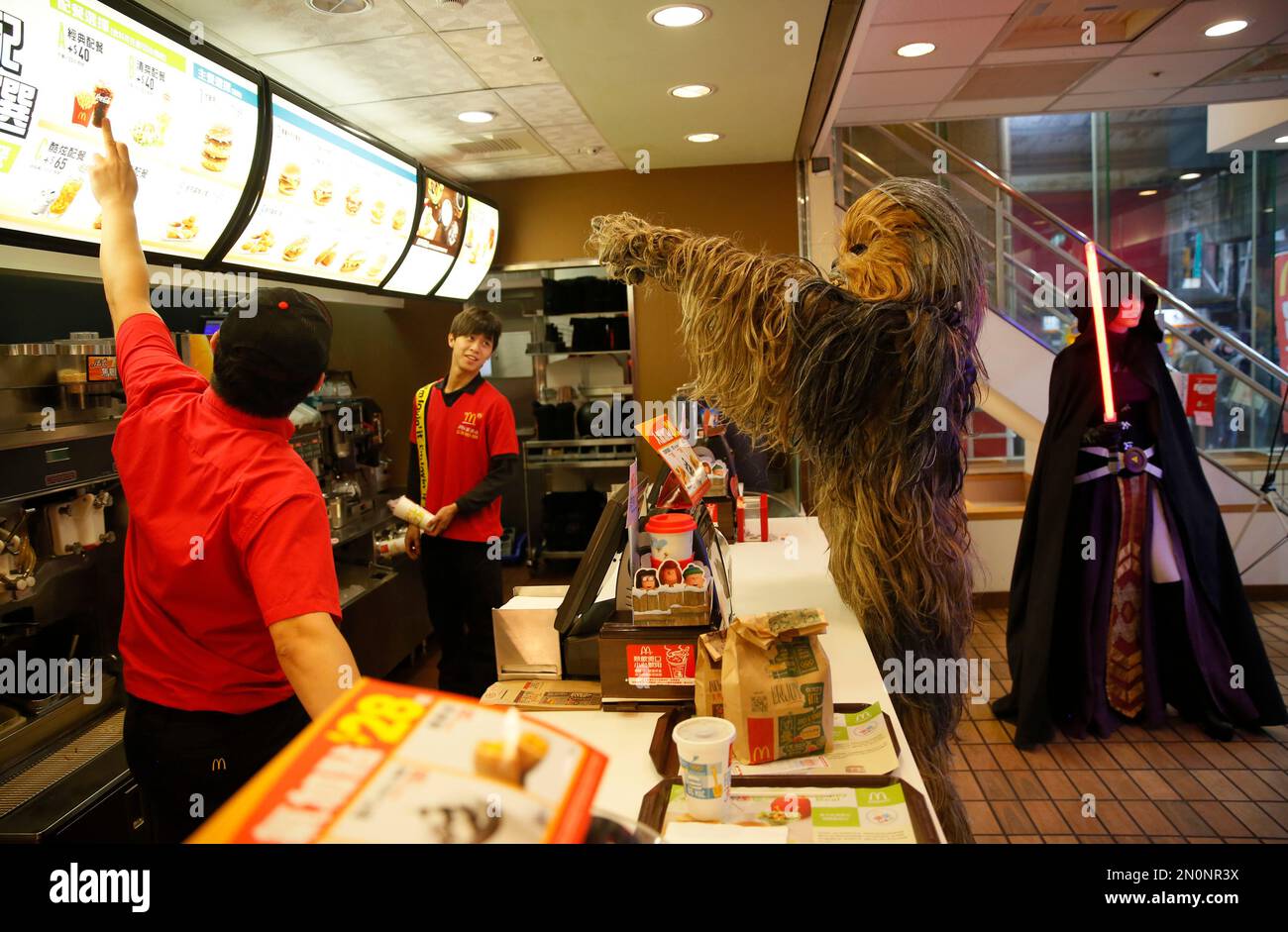 In this Dec. 14, 2015, photo, Star Wars fans dressed in character order ...