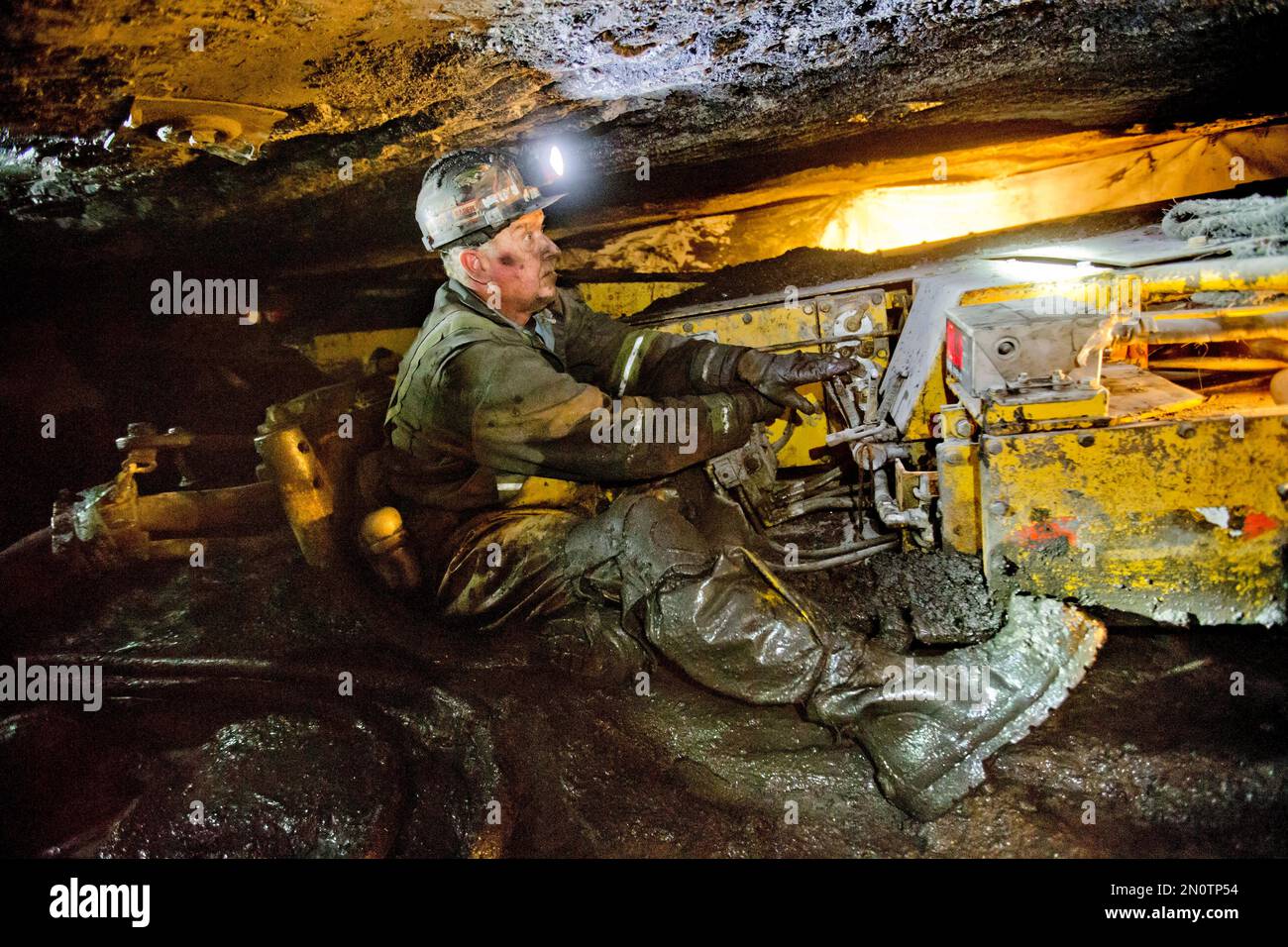 Scott Tiller, a coal miner of 31 years, operates a continuous miner ...