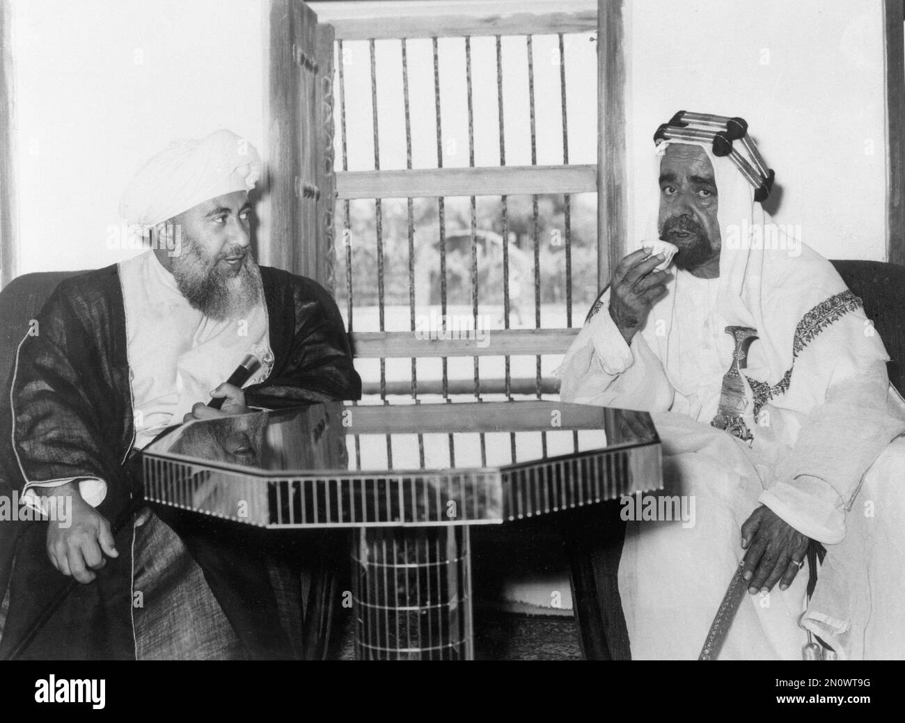 Said Bin Taimur, the Sultan of Muscat and Oman, drinks coffee with ...