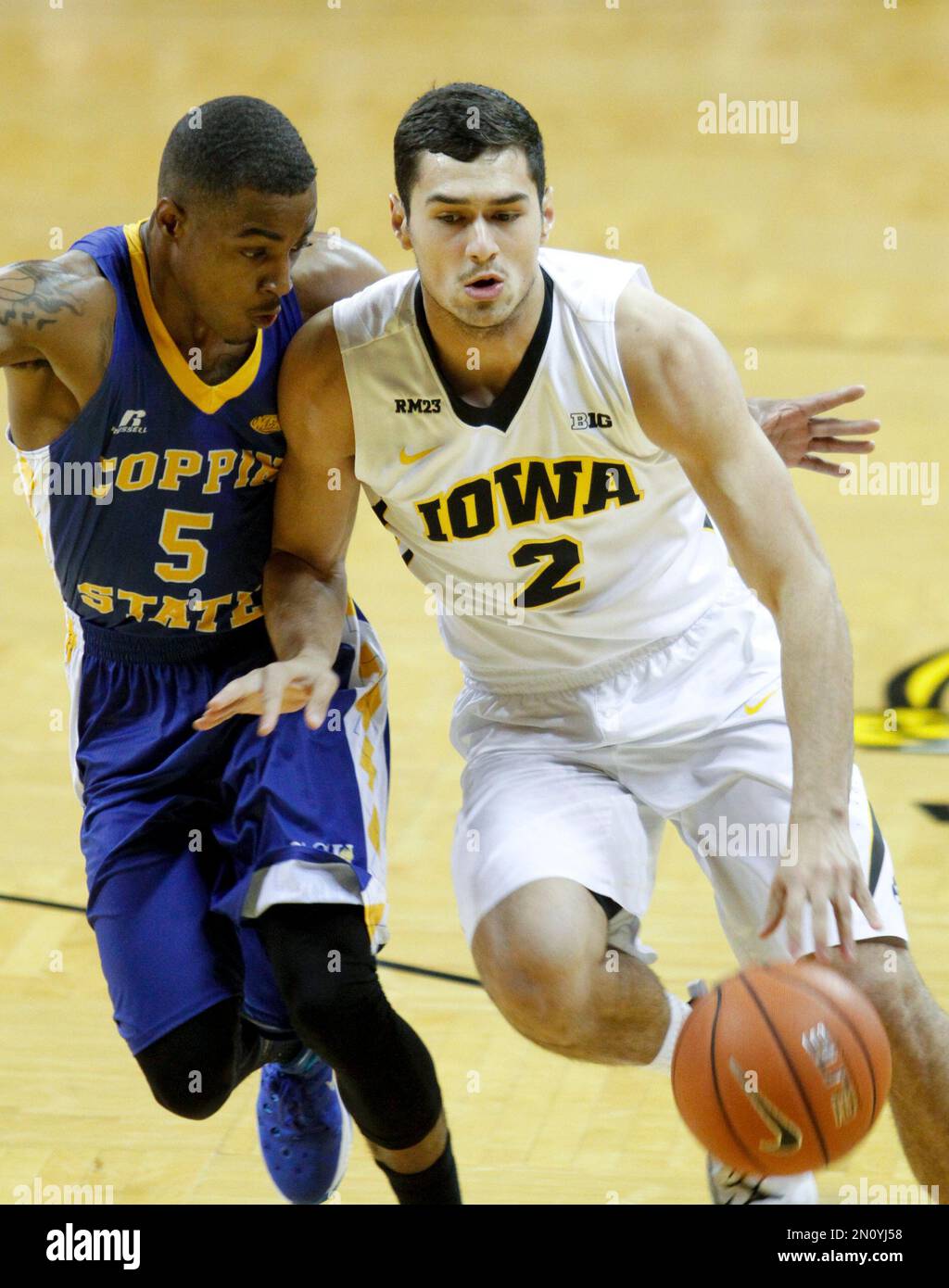 Iowa guard Andrew Flemming (2) drives down the court against Coppin ...
