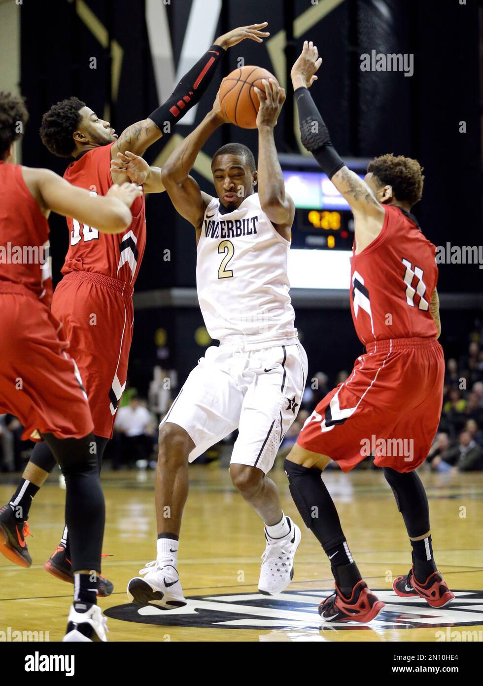 Vanderbilt guard Joe Toye (2) drives between Austin Peay defenders John ...