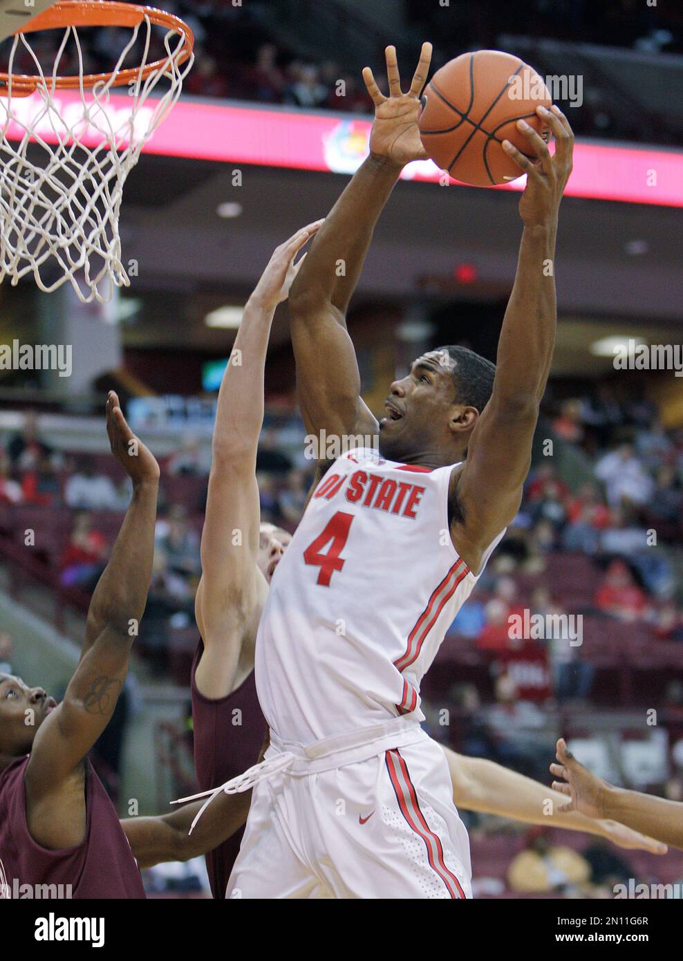 Ohio State's Daniel Giddens, right, shoots over Walsh's Ditalion Battle ...