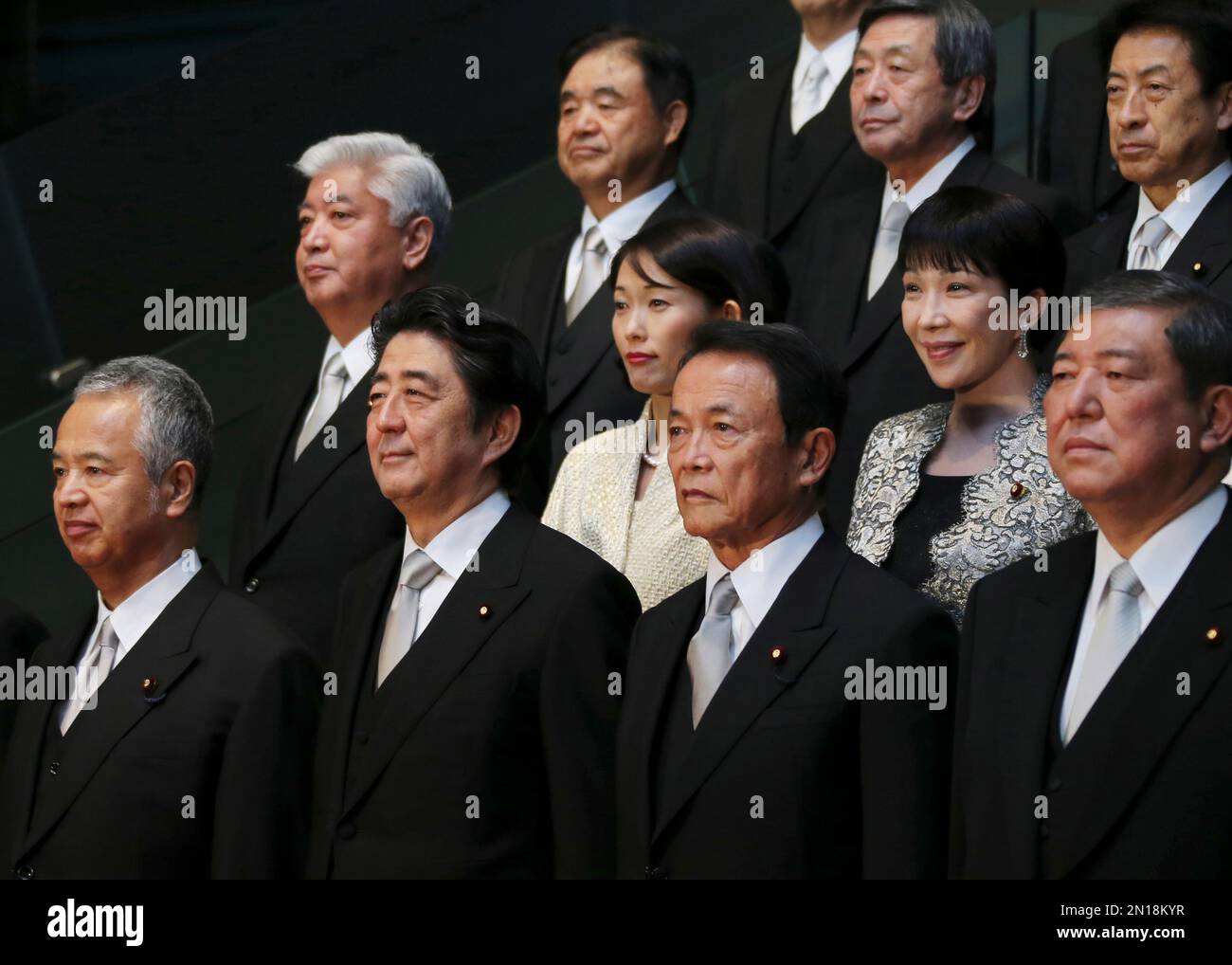 Japanese Prime Minister Shinzo Abe, second left at bottom row, and his ...