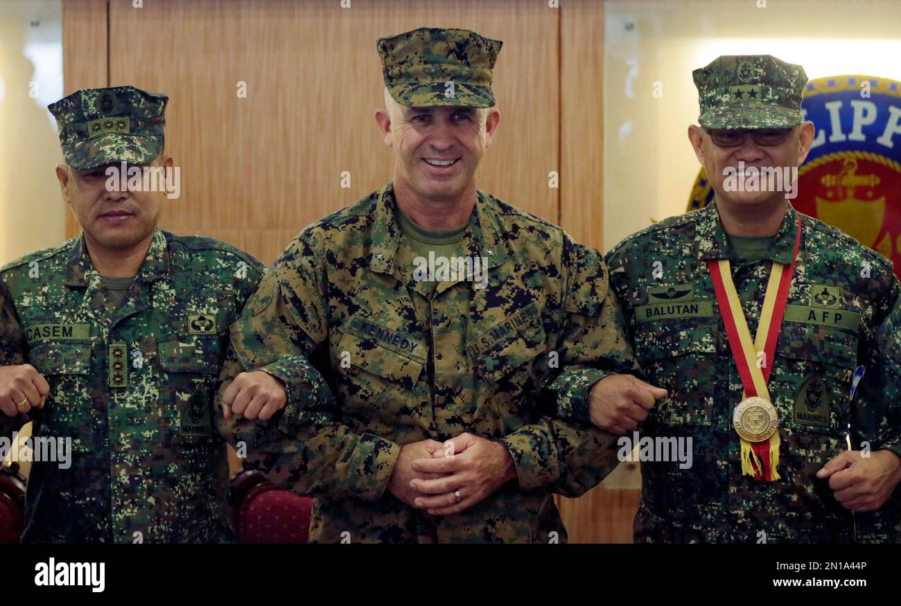 U.S. Marine Brig.Gen. Paul Kennedy, center, Commanding General of the ...