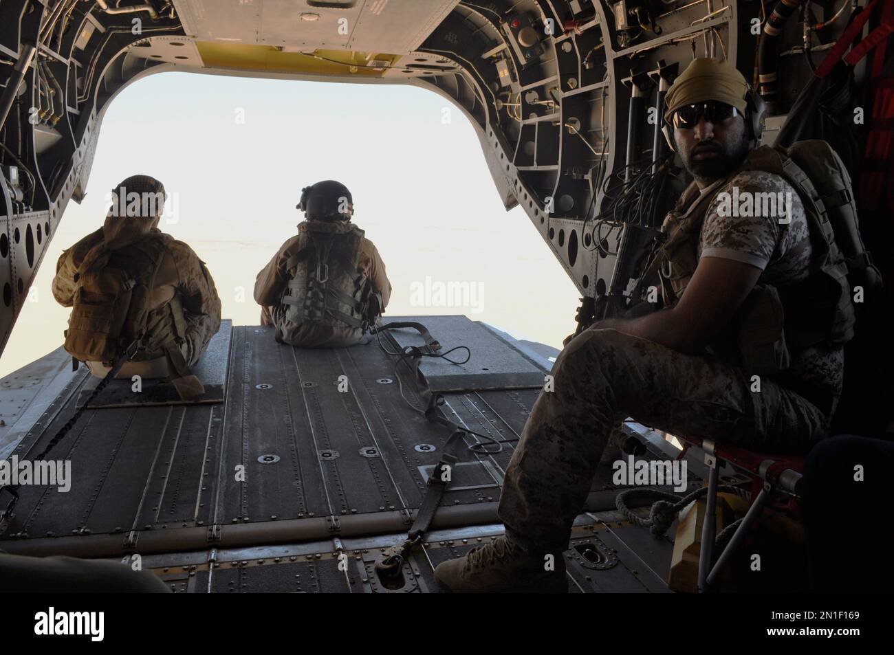 Emirati soldiers stand guard out the rear gate of a Chinook military ...
