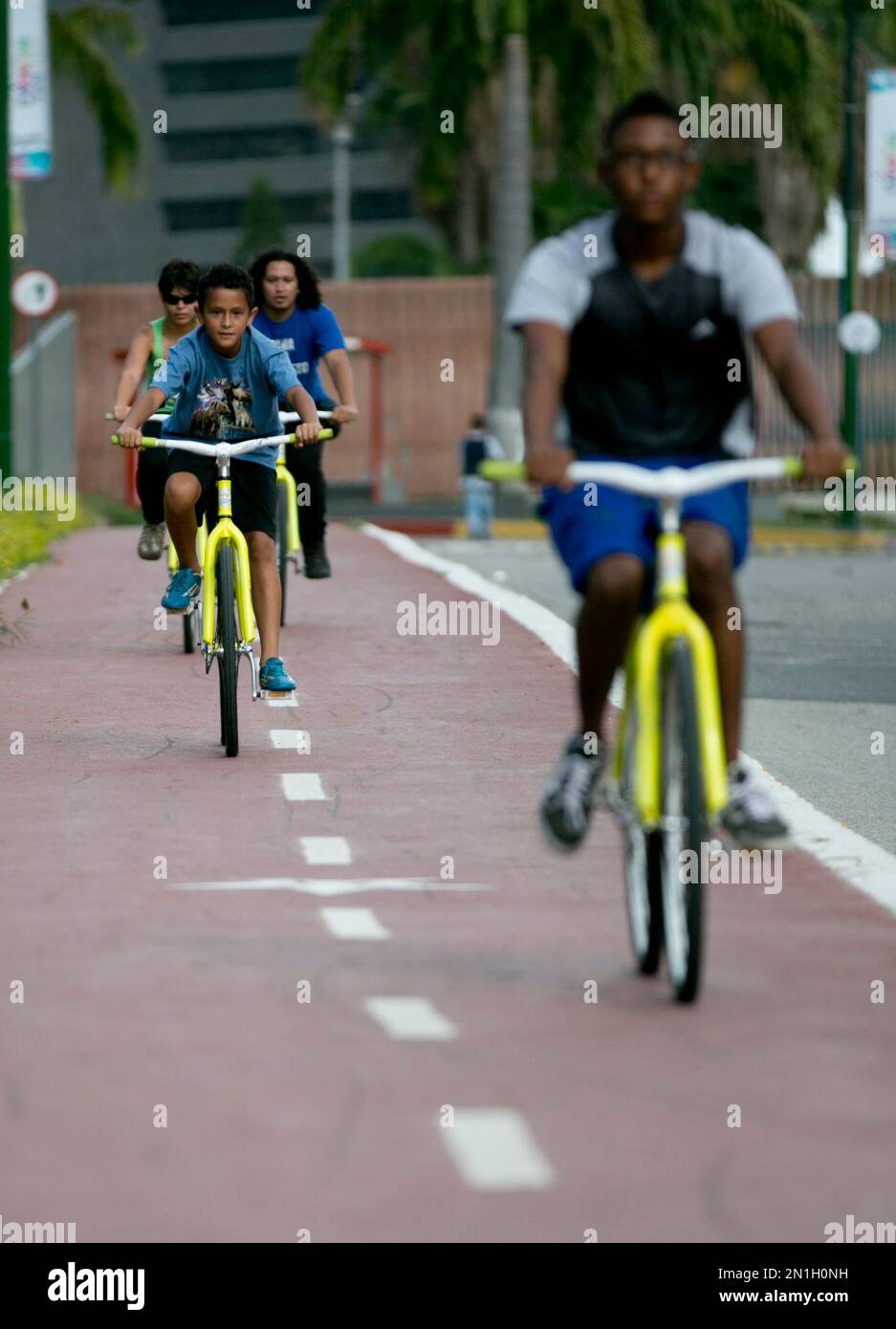 In this Sept. 4, 2015 photo, people ride public bicycles on a bike path ...