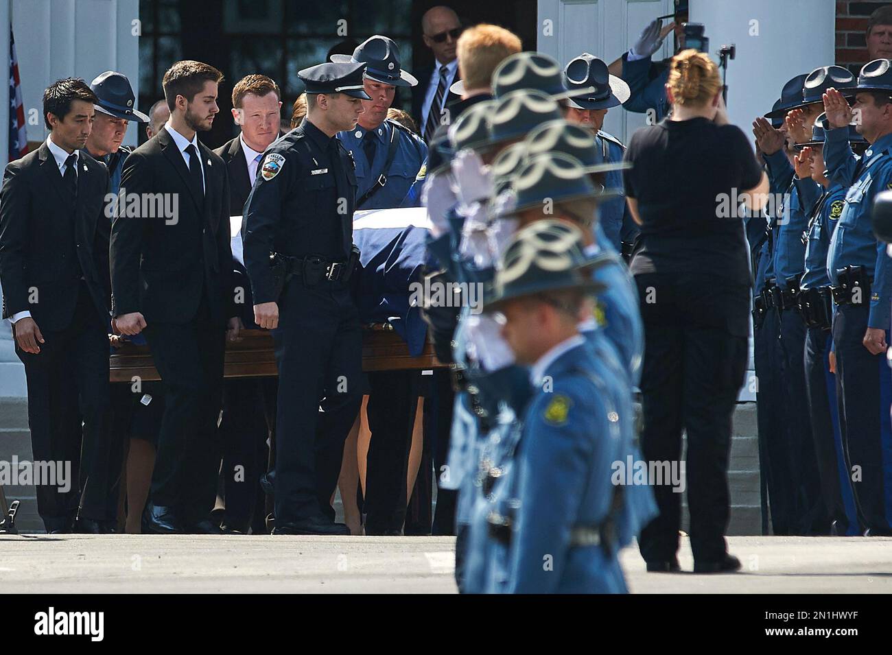 Pallbearers carry the casket of Missouri State Highway Patrol trooper ...