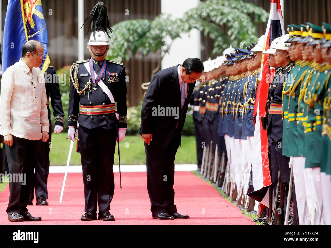 Thai Prime Minister Gen. Prayuth Chan-ocha, center, bows to pay ...