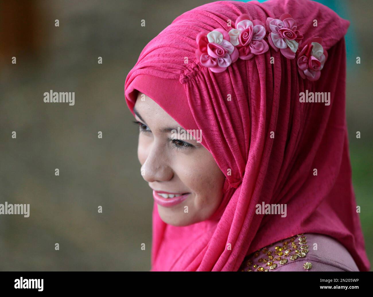 A Filipino Muslim poses for a souvenir shot following prayers at Manila ...