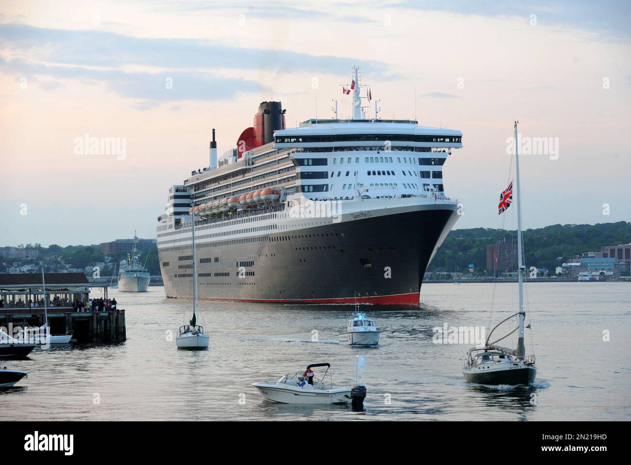 IMAGE DISTRIBUTED FOR CUNARD - Followed by the Royal Canadian Navy's ...