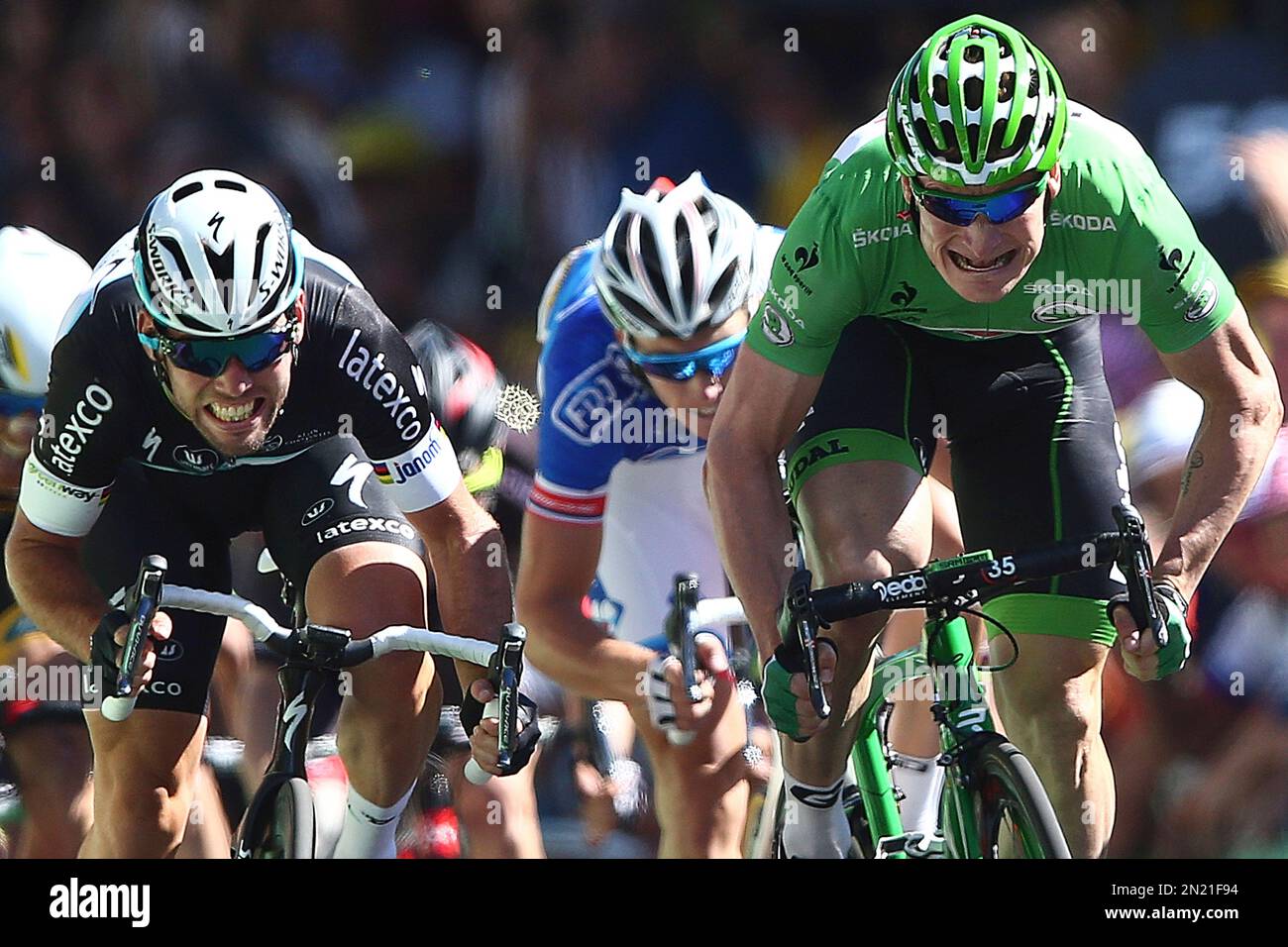 Britain's sprinter Mark Cavendish, left, strains as he sprint towards ...