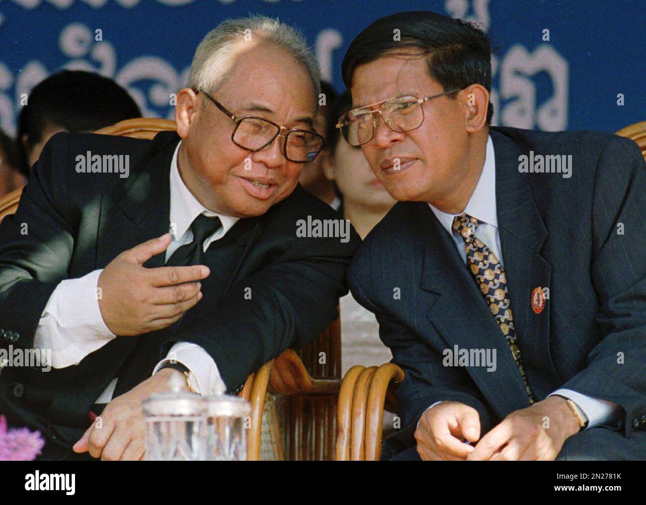 FILE - In this Jan. 7, 1998, file photo, Cambodian People's Party Chairman Chea Sim, left, talks ...
