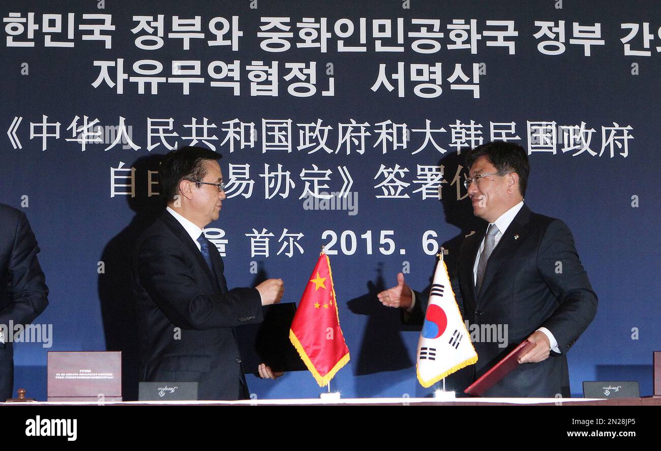 Chinese Commerce Minister Gao Hucheong, left, and South Korean ...