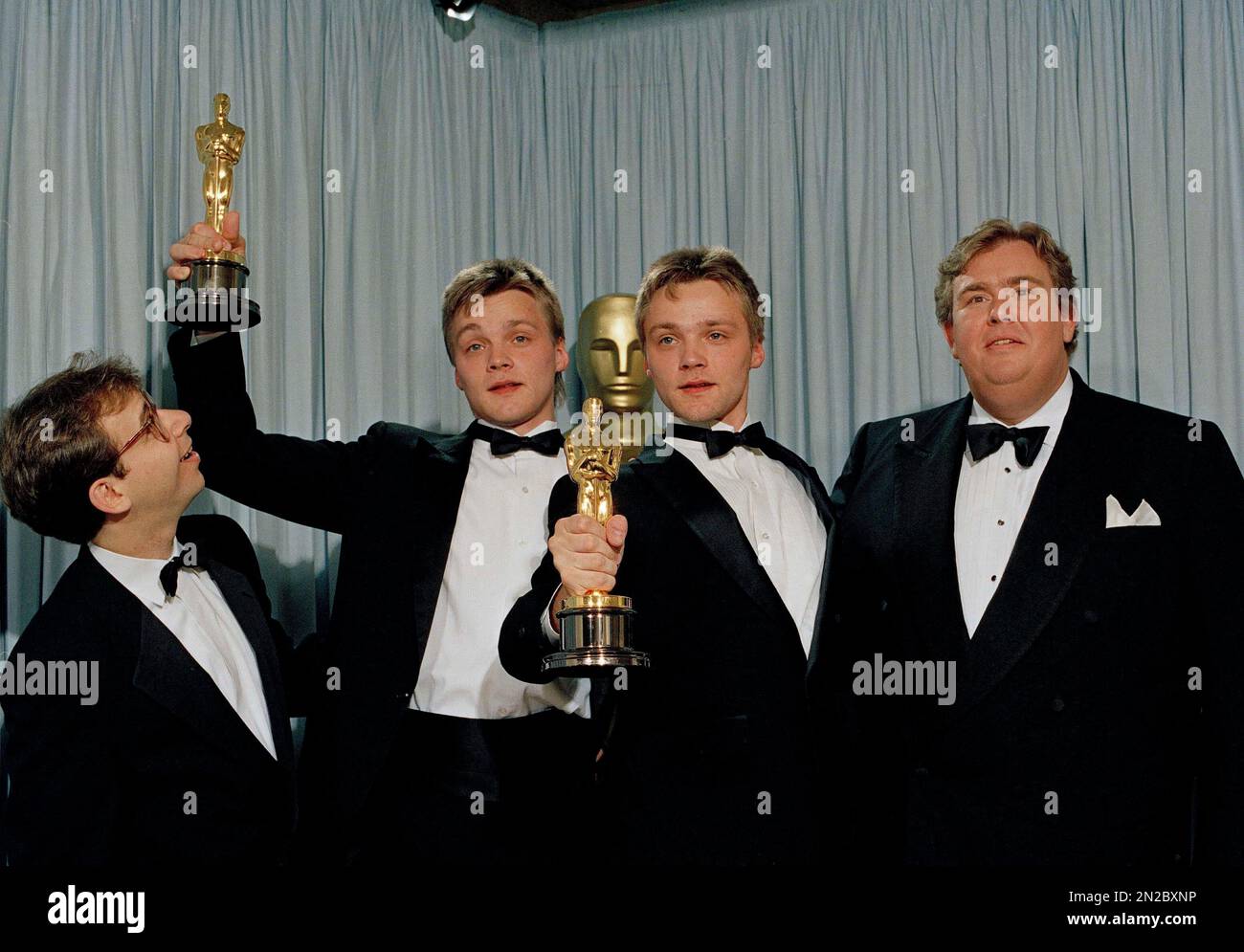 Rick Moranis, left, and John Candy, right, flank Christoph (second from ...