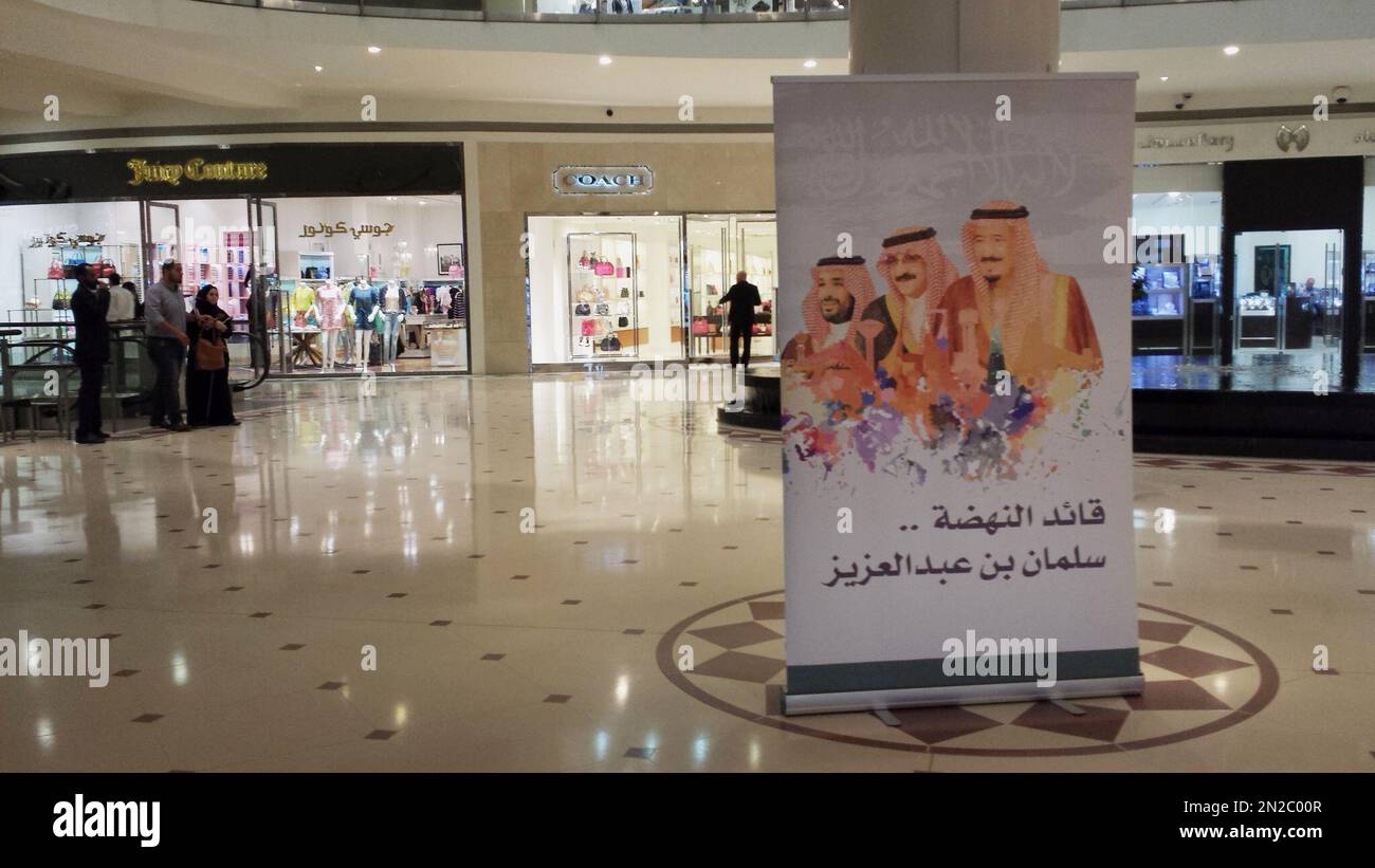 In this May 6, 2015 photo, a new poster showing the images of Saudi ...