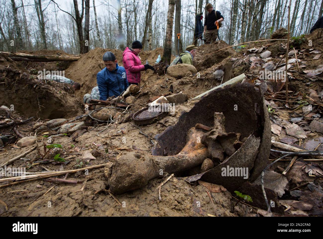 In this photo taken Saturday, May 2, 2015, members of an excavation ...