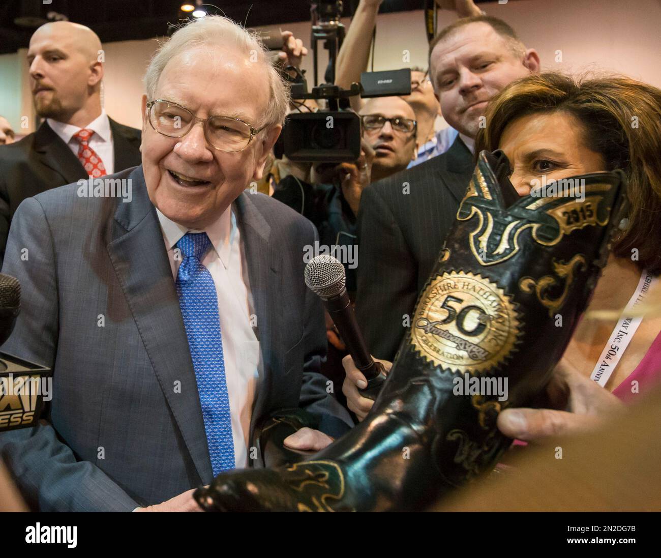 Berkshire Hathaway Chairman and CEO Warren Buffett is presented with ...