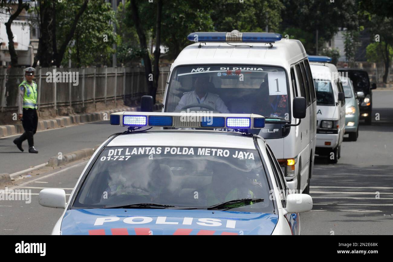 Ambulances carrying the bodies of Australian death-row prisoners Andrew ...