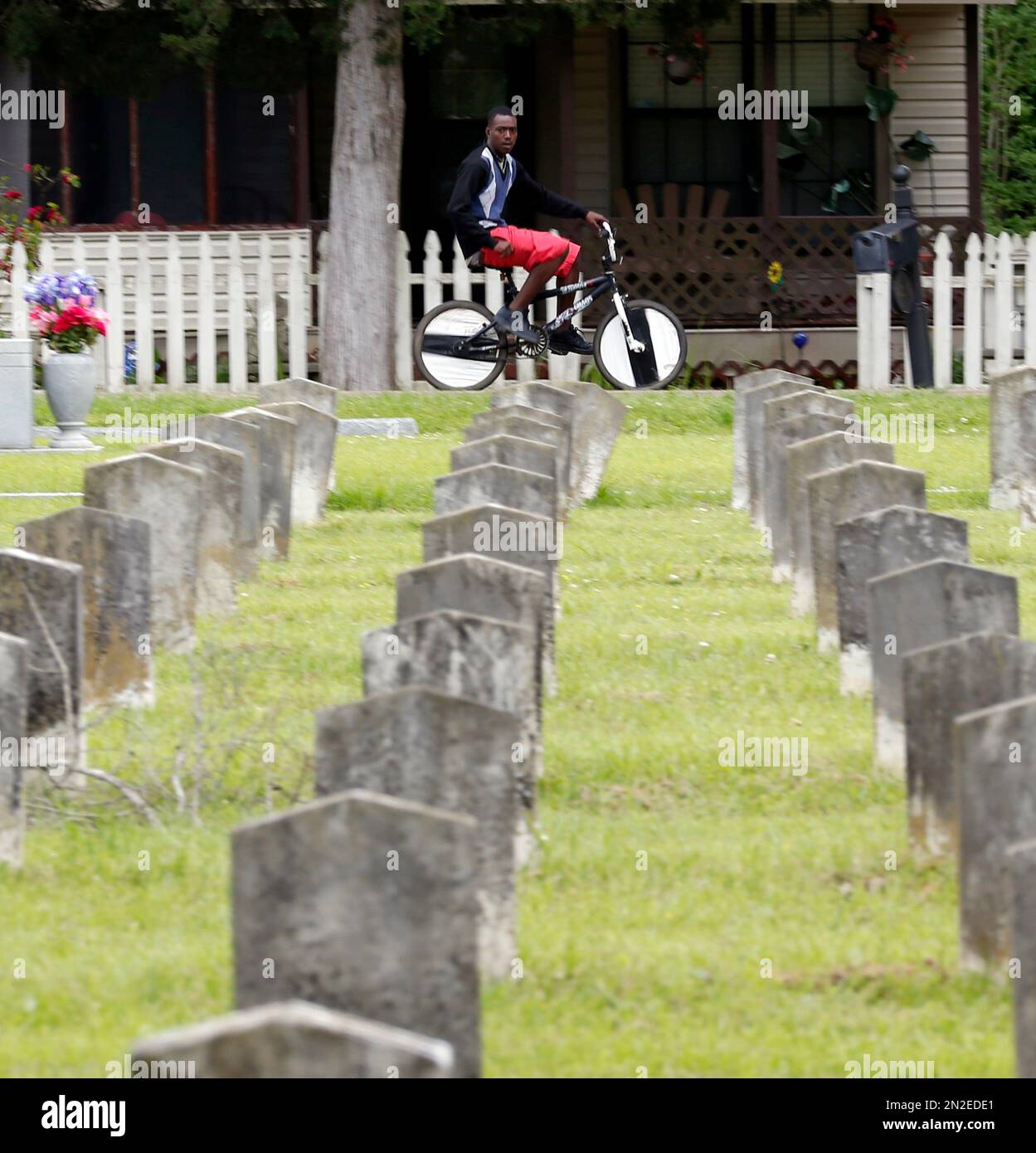 A Canton, Miss., resident observes the Confederate soldiers markers as ...
