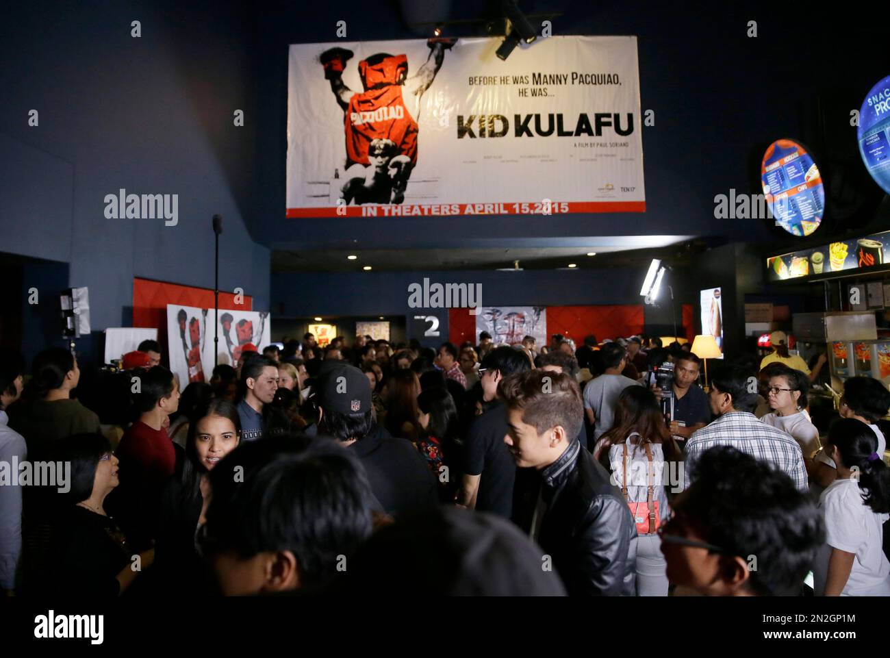 In this Tuesday, April 14, 2015 photo, people crowd to watch the ...