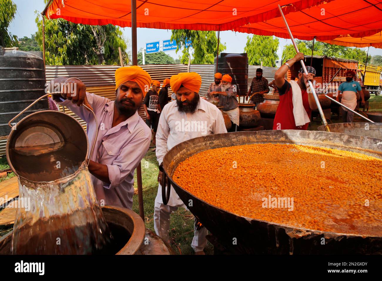 Indian Sikhs prepare food for devotees at a Sikh temple on Baisakhi, in ...