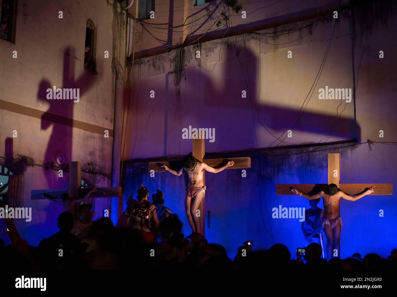 Actor Lucas Valentim, center, plays the role of Jesus during the ...