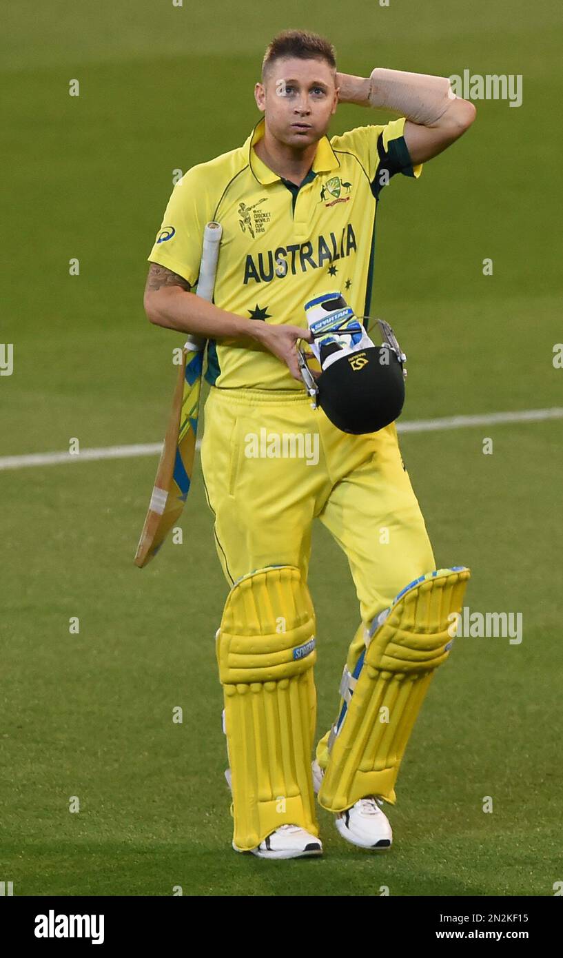 Australian captain Michael Clarke walks back to the pavilion after his ...