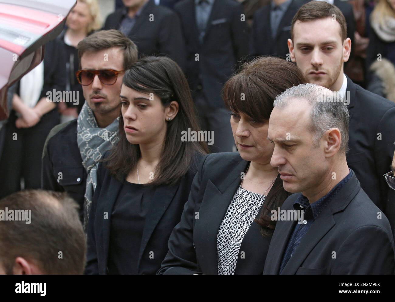 Family members of French Olympic champion swimmer Camille Muffat, left ...