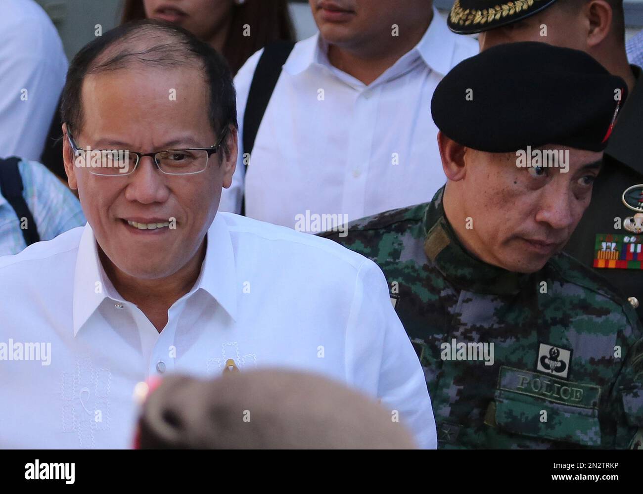 Philippine President Benigno Aquino III, left, walks with New ...