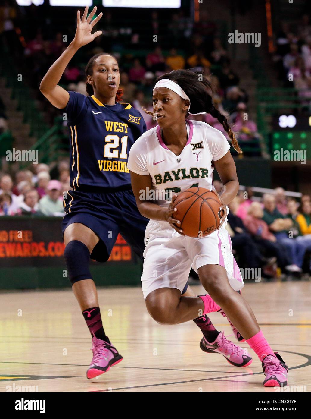West Virginia guard Jessica Morton (21) is unable to stop a drive to ...
