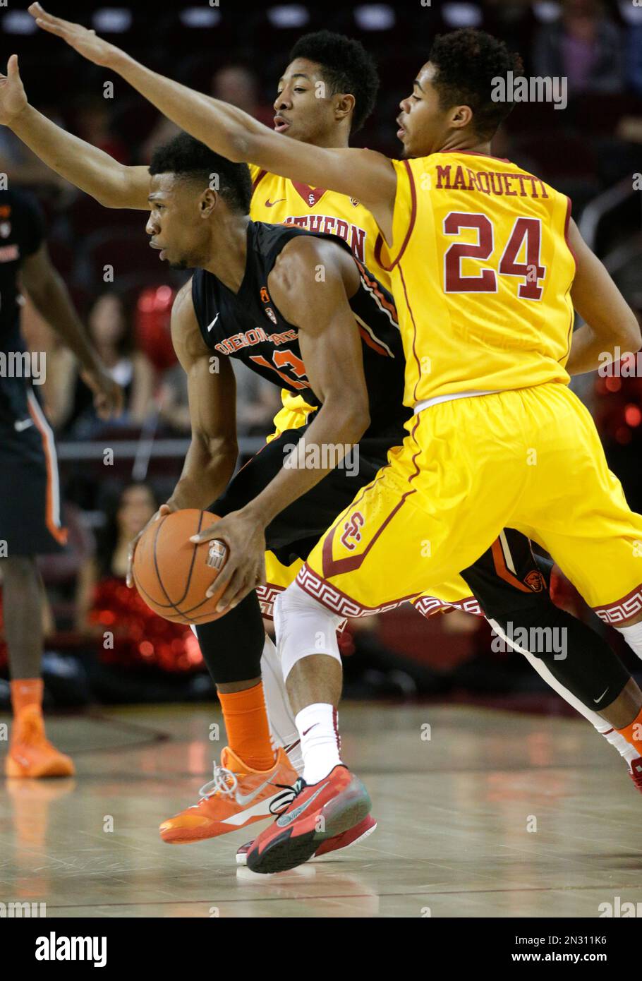 Oregon State's Langston Morris-Walker, left, is double-teamed by ...