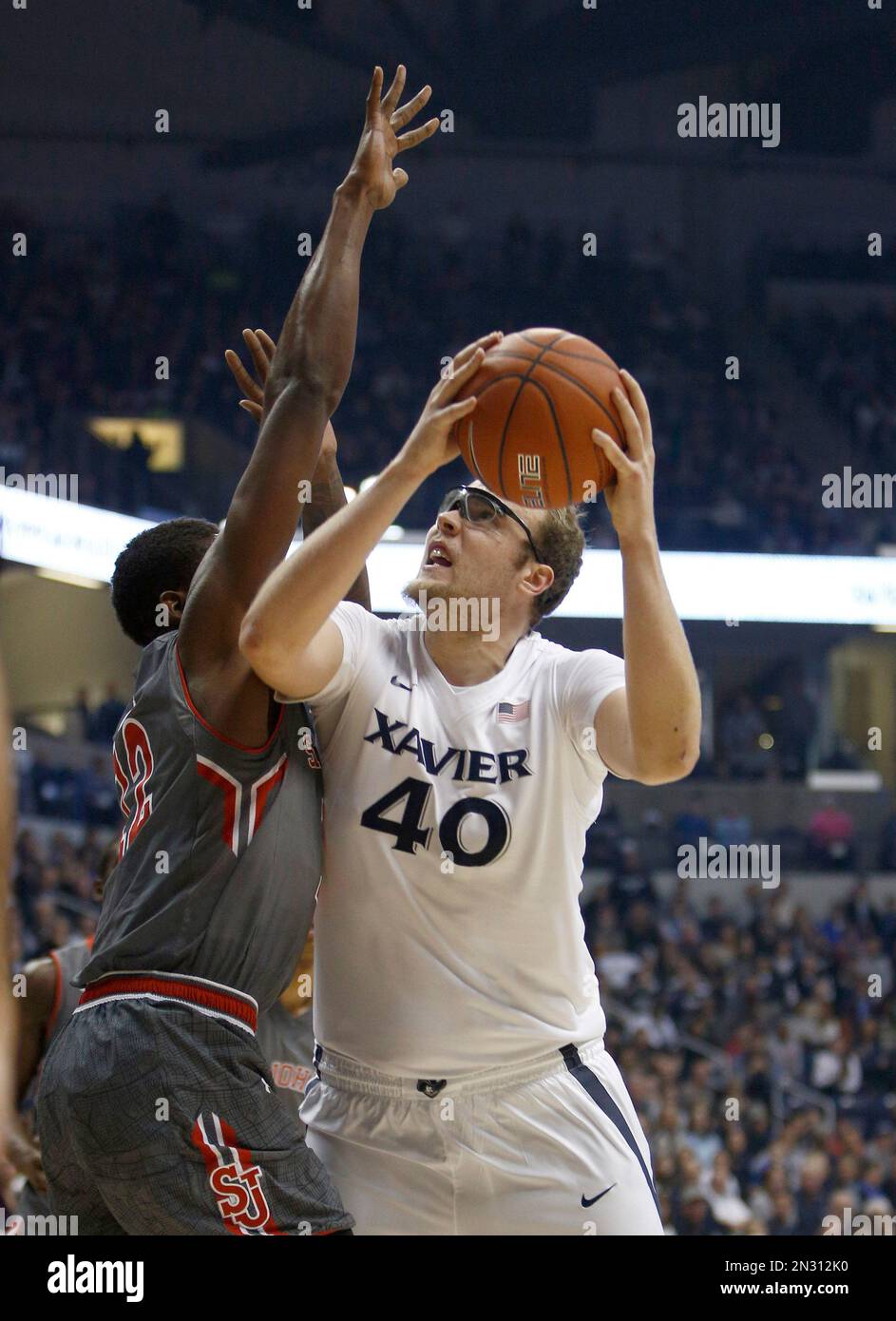 Xavier center Matt Stainbrook (40) looks to shoot against St. John's ...