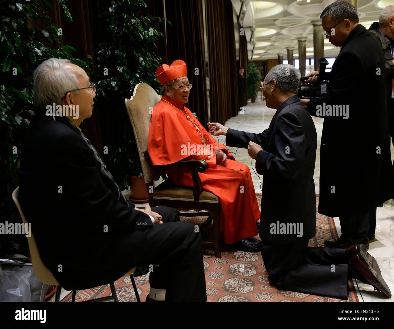 Newly-elected Cardinal Pierre Nguyen Van Nhon, of Vietnam, center ...
