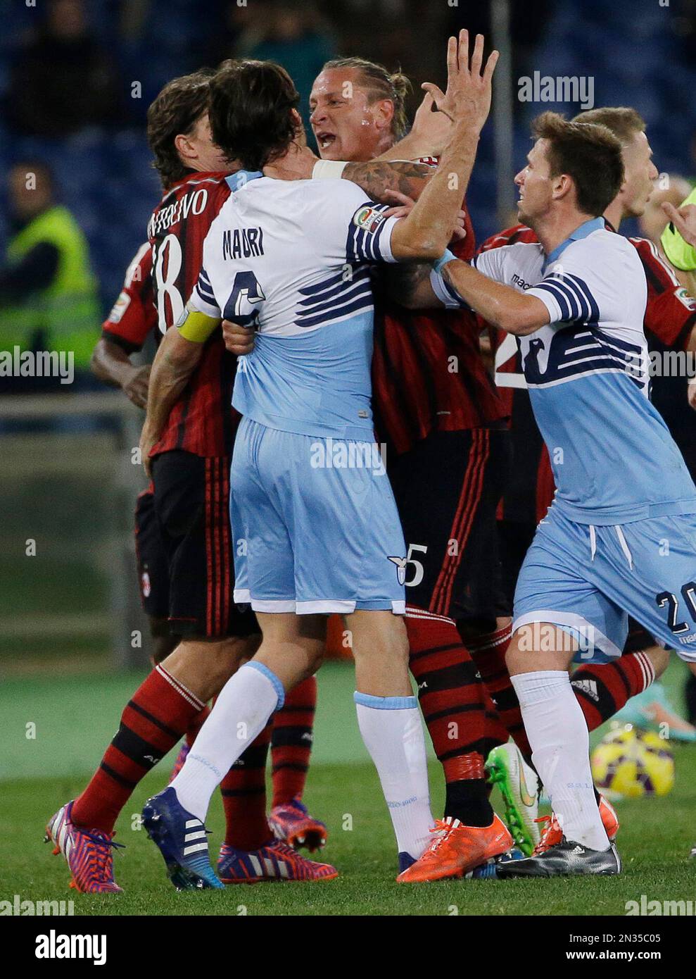 Lazio's Stefano Mauri, back to camera, argues with AC Milan's Philippe ...