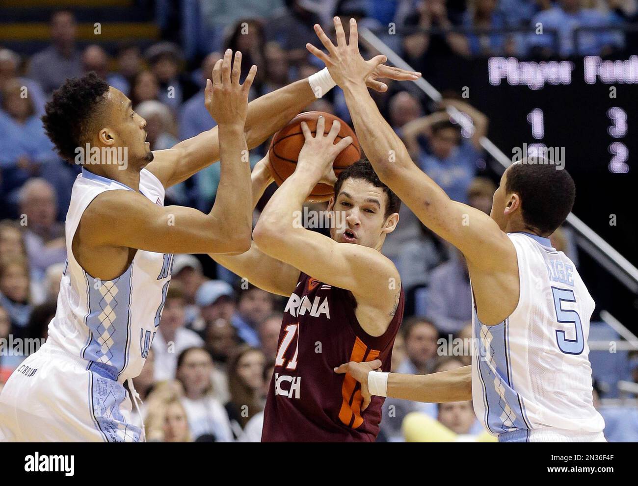North Carolina's J.P. Tokoto, left, and Marcus Paige (5) guard Virginia ...