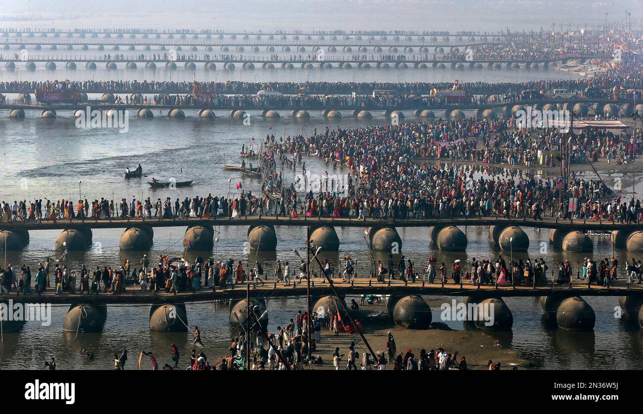 FILE - In this Feb. 10, 2013 file photo, Hindu devotees walk across ...