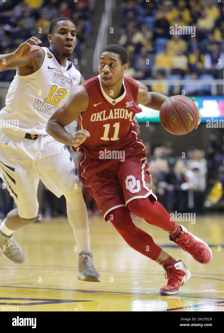 Oklahoma guard Isaiah Cousins (11) drives by West Virginia guard Tarik ...