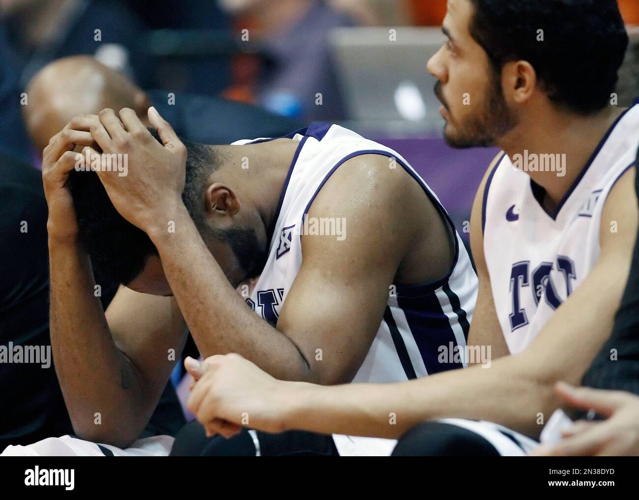 TCU guard Trey Zeigler, left, and TCU forward Amric Fields look on as ...