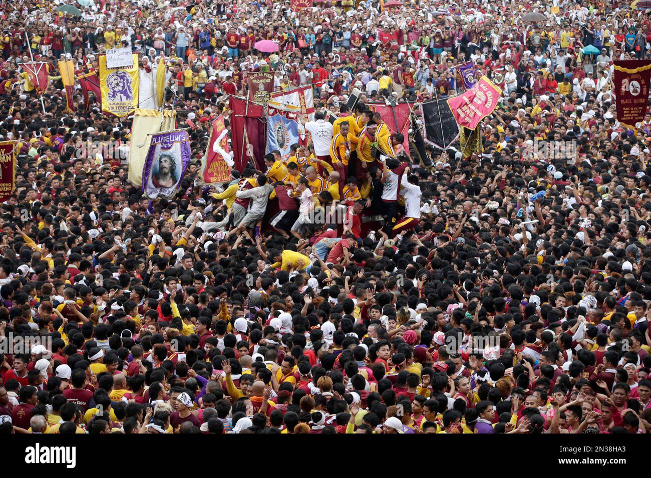 In this Friday Jan. 9, 2015 photo, Filipino devotees carry the image of ...