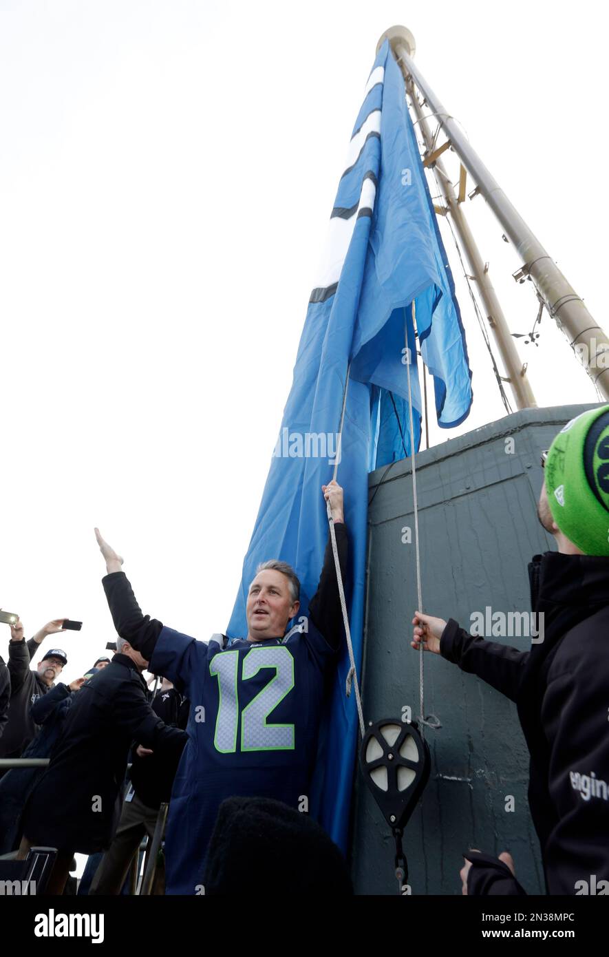 Pearl Jam lead guitarist Mike McCready, center, turns and waves after ...