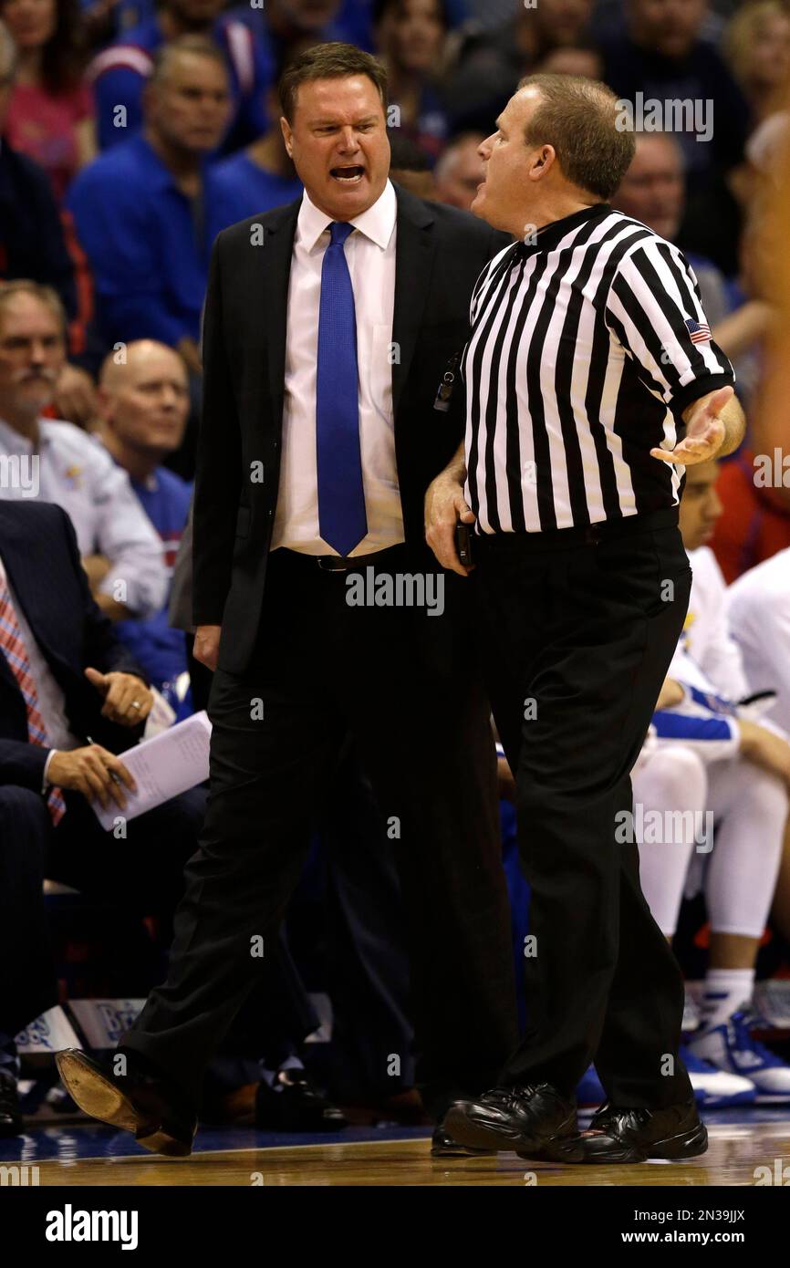 Kansas head coach Bill Self, left, has words with referee Gerry Pollard ...